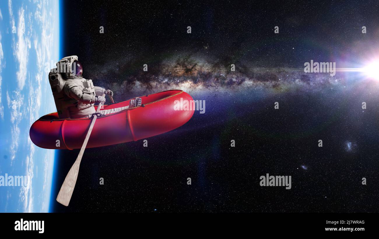 astronaut in red rubber boat in orbit of planet Earth Stock Photo - Alamy