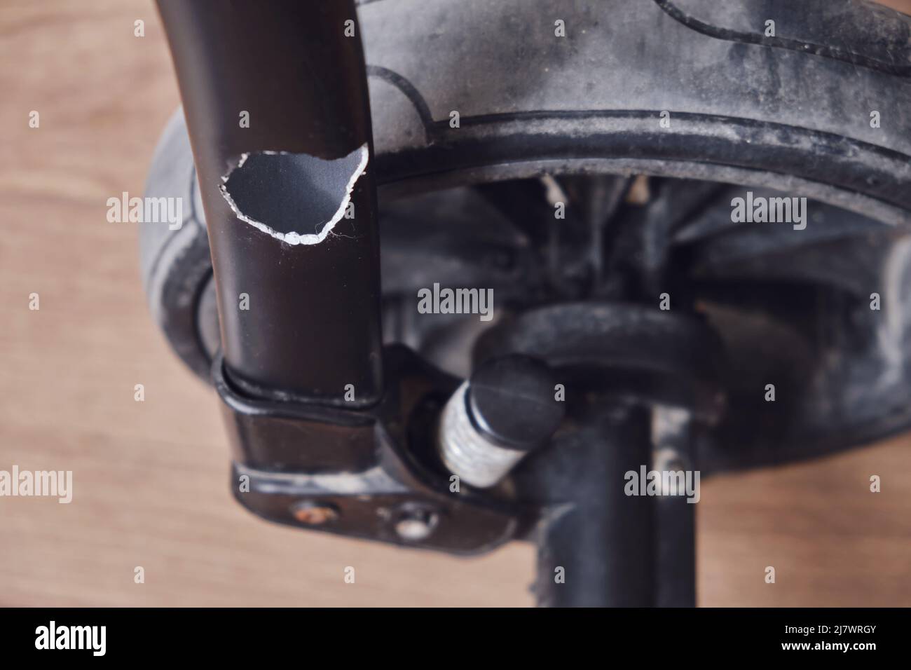 Broken chassis of a baby stroller, damage to the crossbar of the metal ...