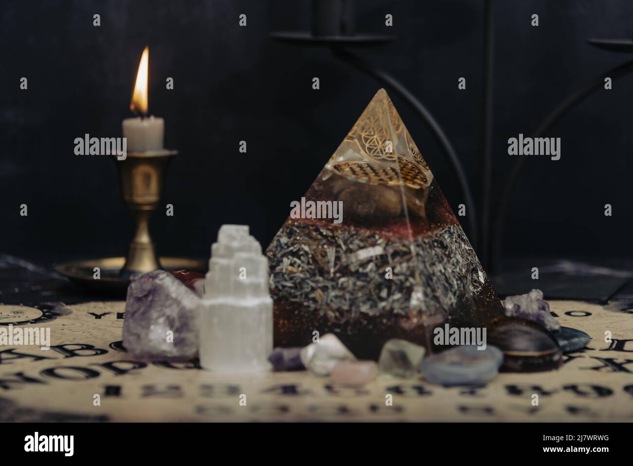 Mystic ritual with Ouija and candles. Devil's board concept, black ...