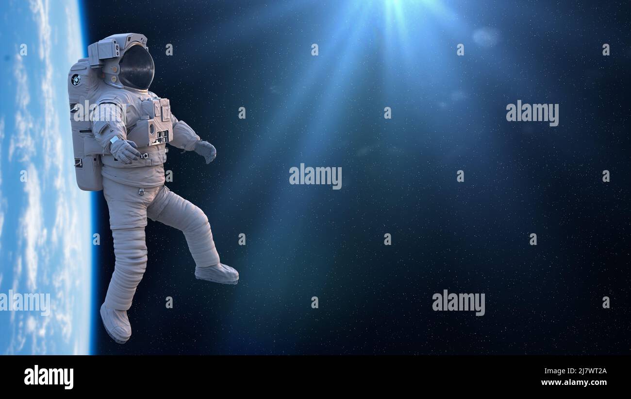 astronaut during a space walk in orbit of planet Earth Stock Photo - Alamy