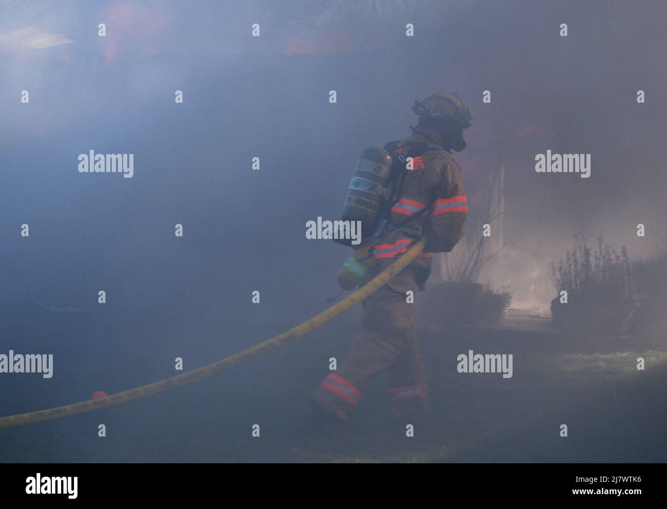 Firefighters Battling a Building Fire Stock Photo - Alamy