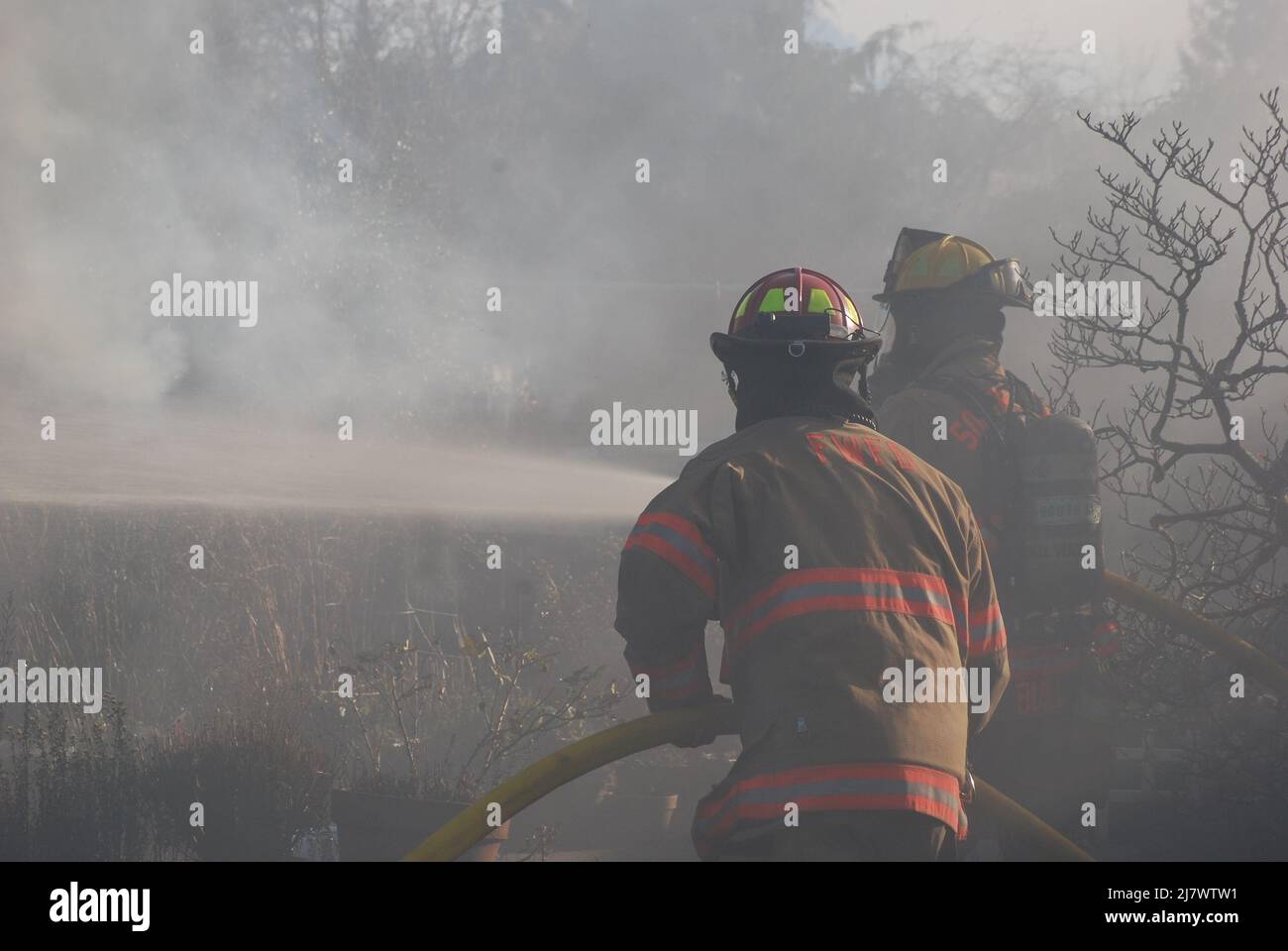 Firefighters Battling a Building Fire Stock Photo - Alamy