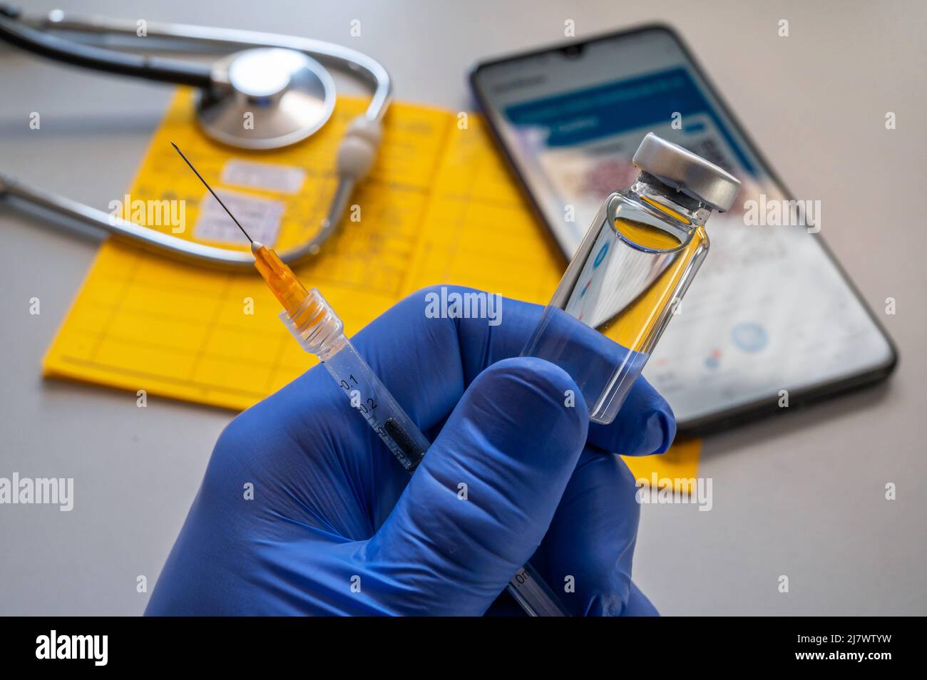 Vaccine with syringe and vaccination card in a doctor's office Stock ...