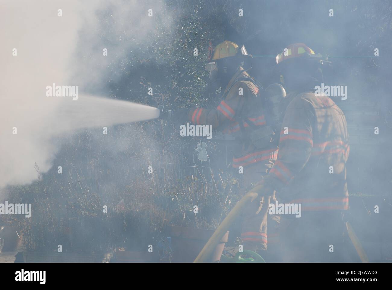 Firefighters Battling a Building Fire Stock Photo - Alamy