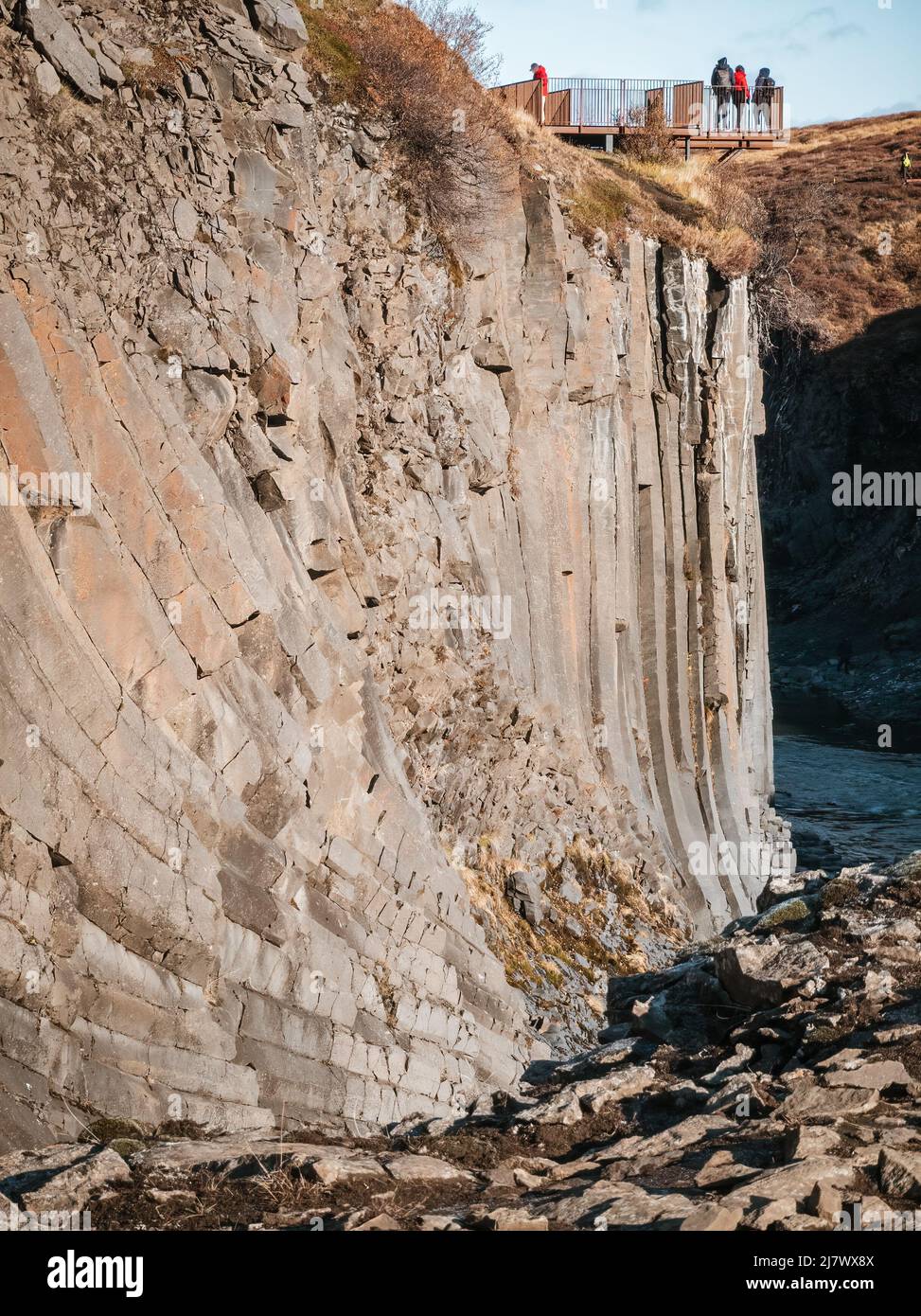 Viewpoint with tourists over narrow basalt columns canyon Stock Photo ...