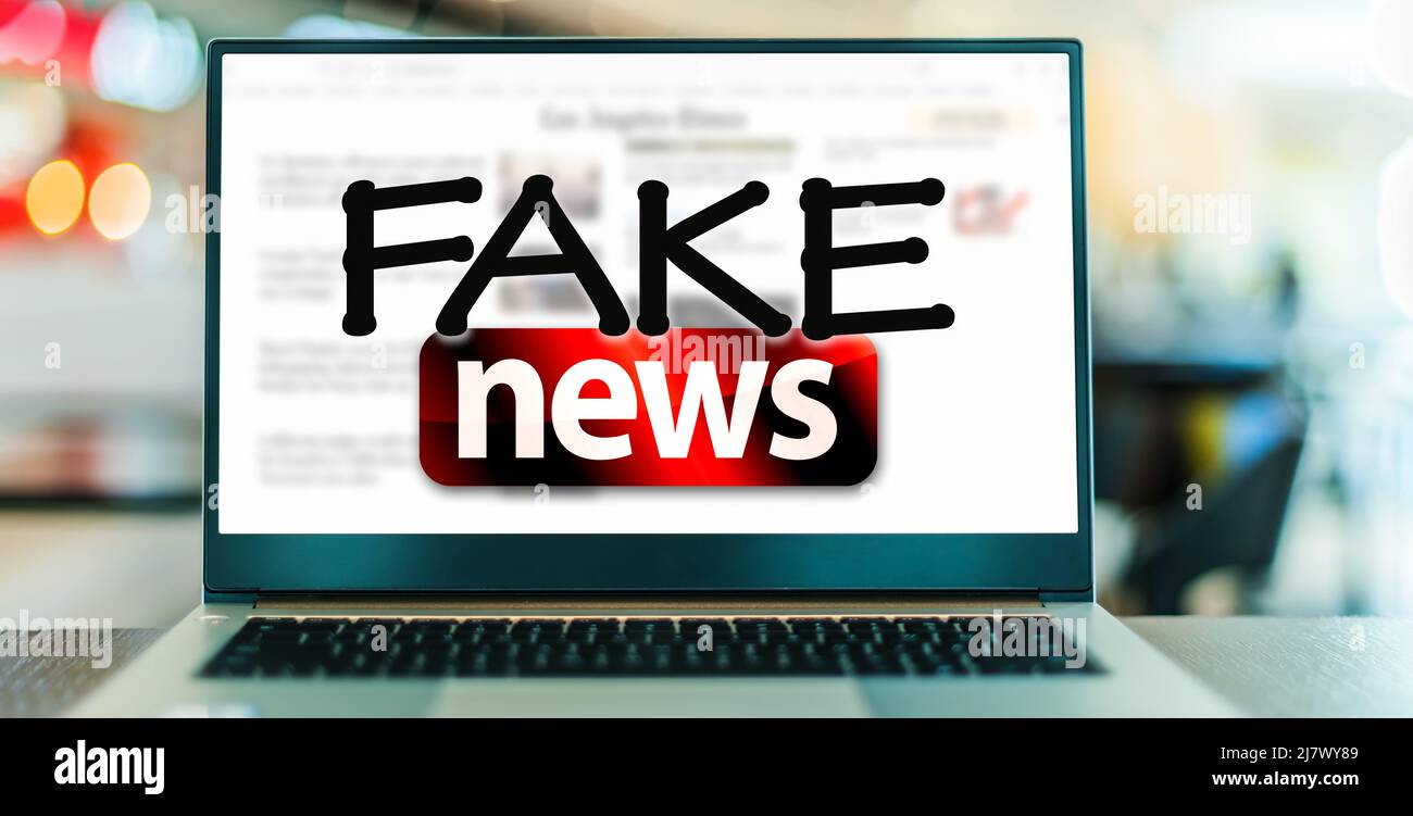 Laptop computer displaying the sign of 'Fake news' Stock Photo - Alamy