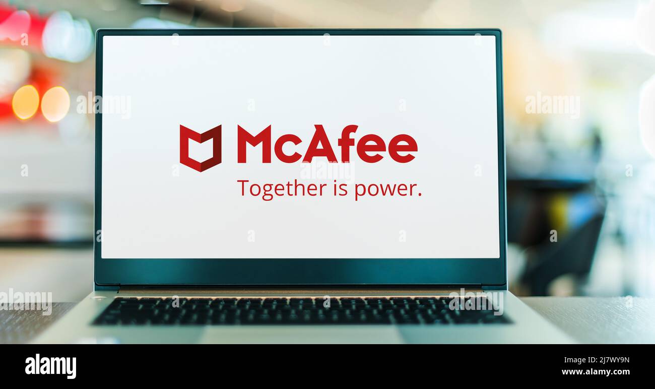 POZNAN, POL - APR 7, 2022: Laptop computer displaying logo of McAfee, a ...