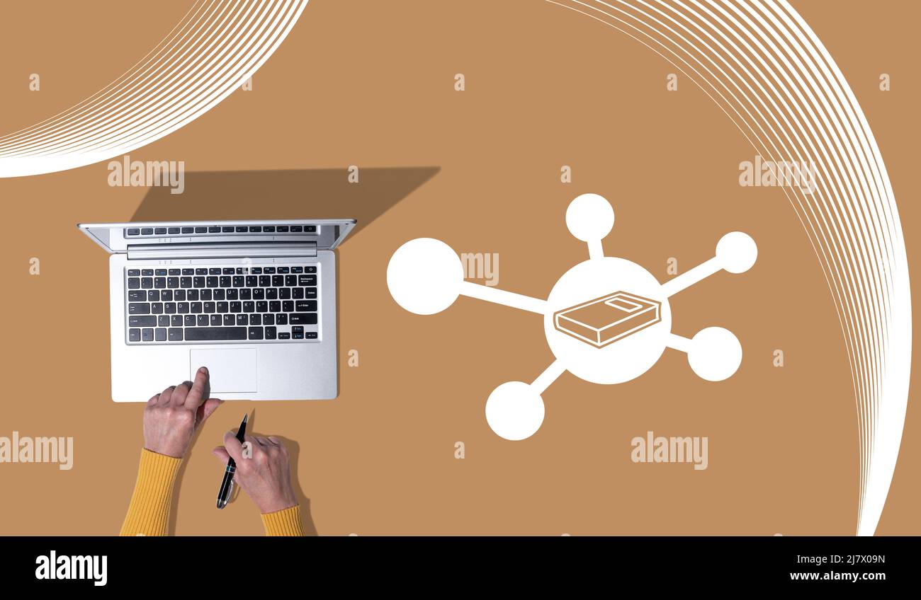 Top view of hands using laptop with symbol of knowledge sharing concept ...