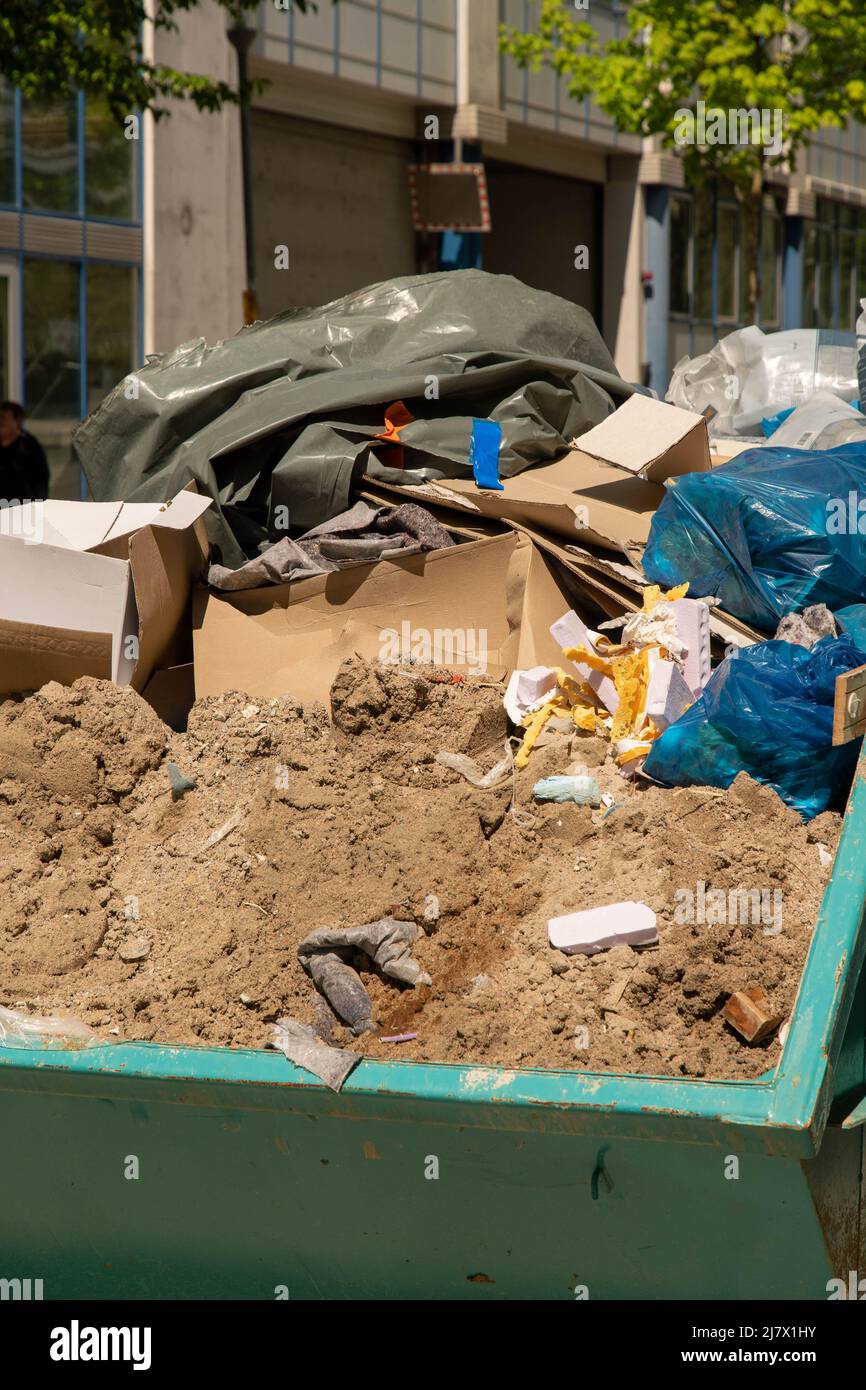 Bush debris container with plastic bags and foils Stock Photo - Alamy