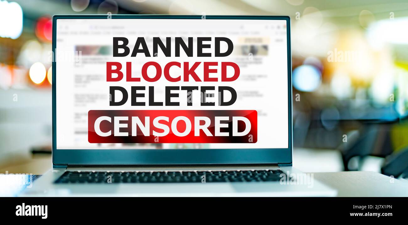 Laptop computer with the sign warning against censorship in social ...