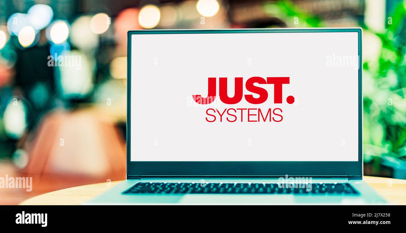 POZNAN, POL - OCT 1, 2021: Laptop computer displaying logo of JustSystems Corporation a Japanese ...