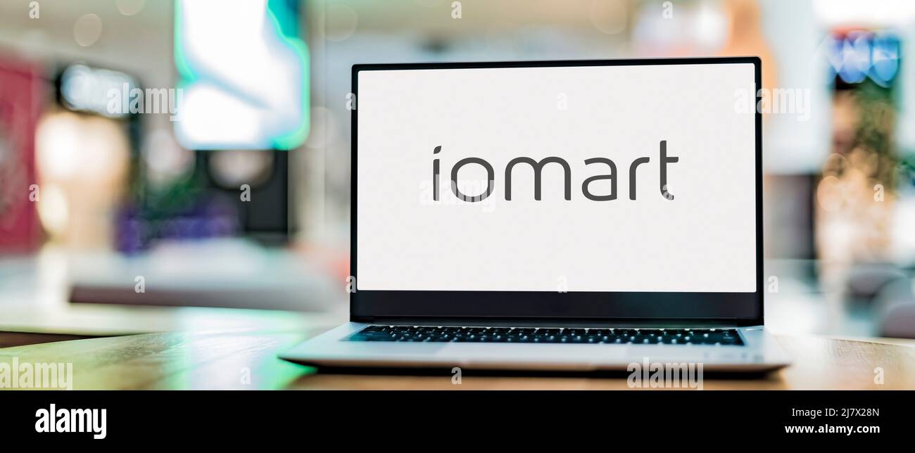 POZNAN, POL - OCT 1, 2021: Laptop computer displaying logo of iomart ...