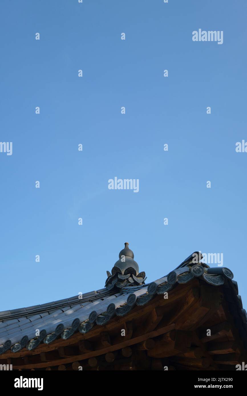 Abstract view of Asian style black roof tiles on a pagoda with empty ...