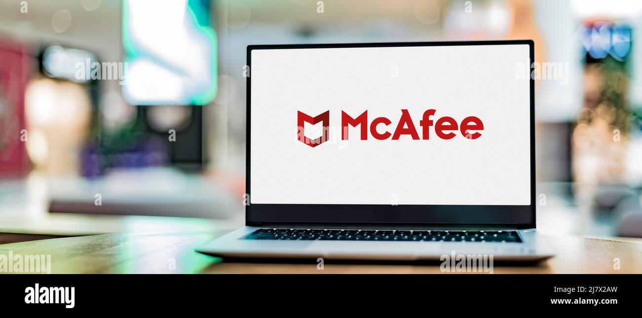 POZNAN, POL - APR 7, 2022: Laptop computer displaying logo of McAfee, a ...
