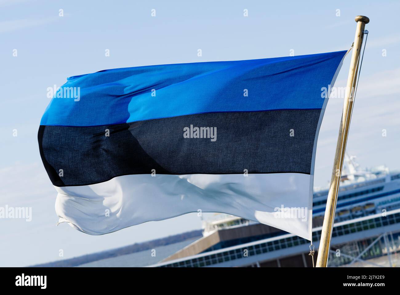 The flag of Estonia - horizontal stripes of blue, black and white on a ...