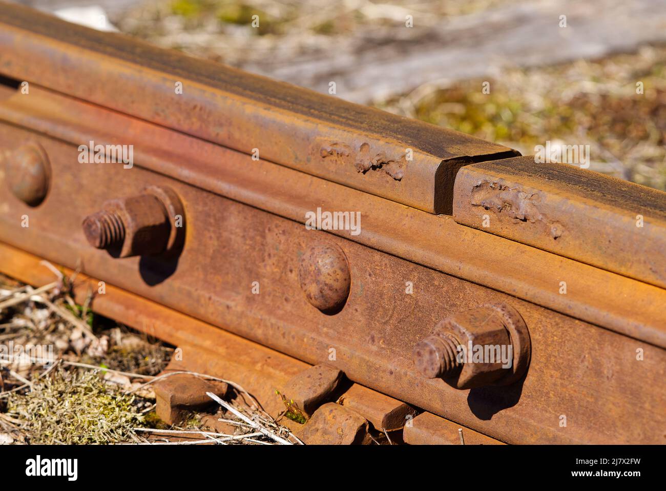 Connecting two rails. Train tracks underlay, rails and crushed stones ...