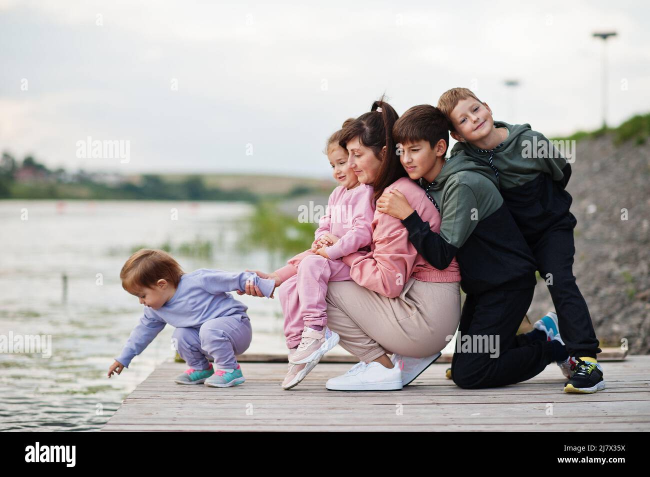 Child hugging infant siblings hi-res stock photography and images - Alamy
