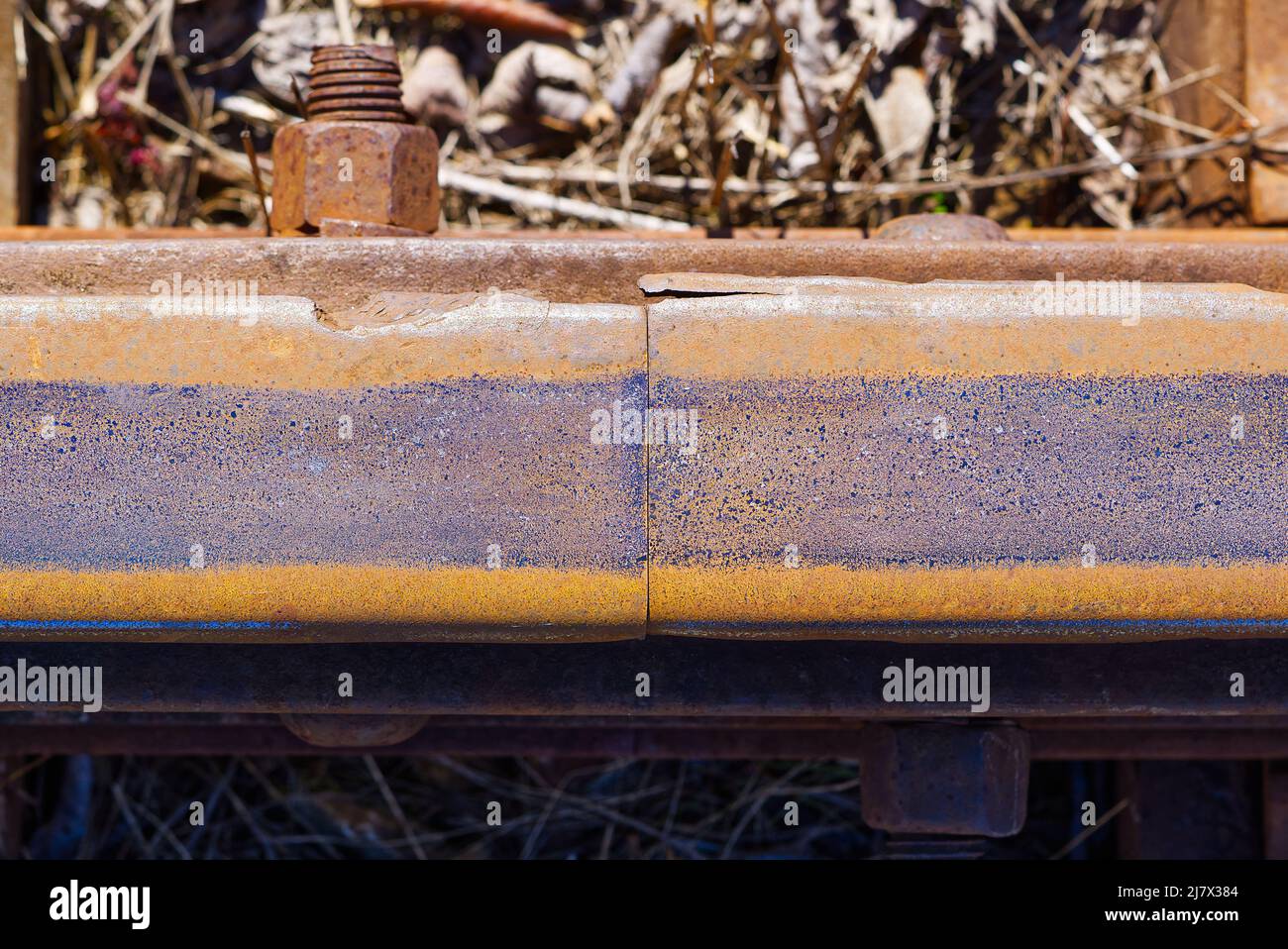 Connecting two rails. Train tracks underlay, rails and crushed stones ...