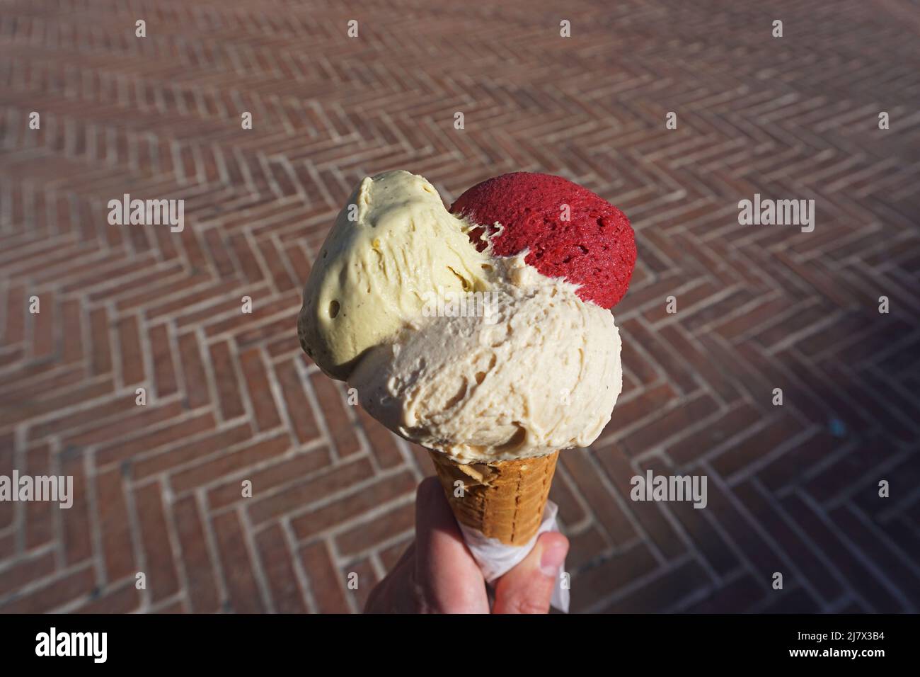 Perfect three flavored gelato cone (Italian ice cream), on the streets ...