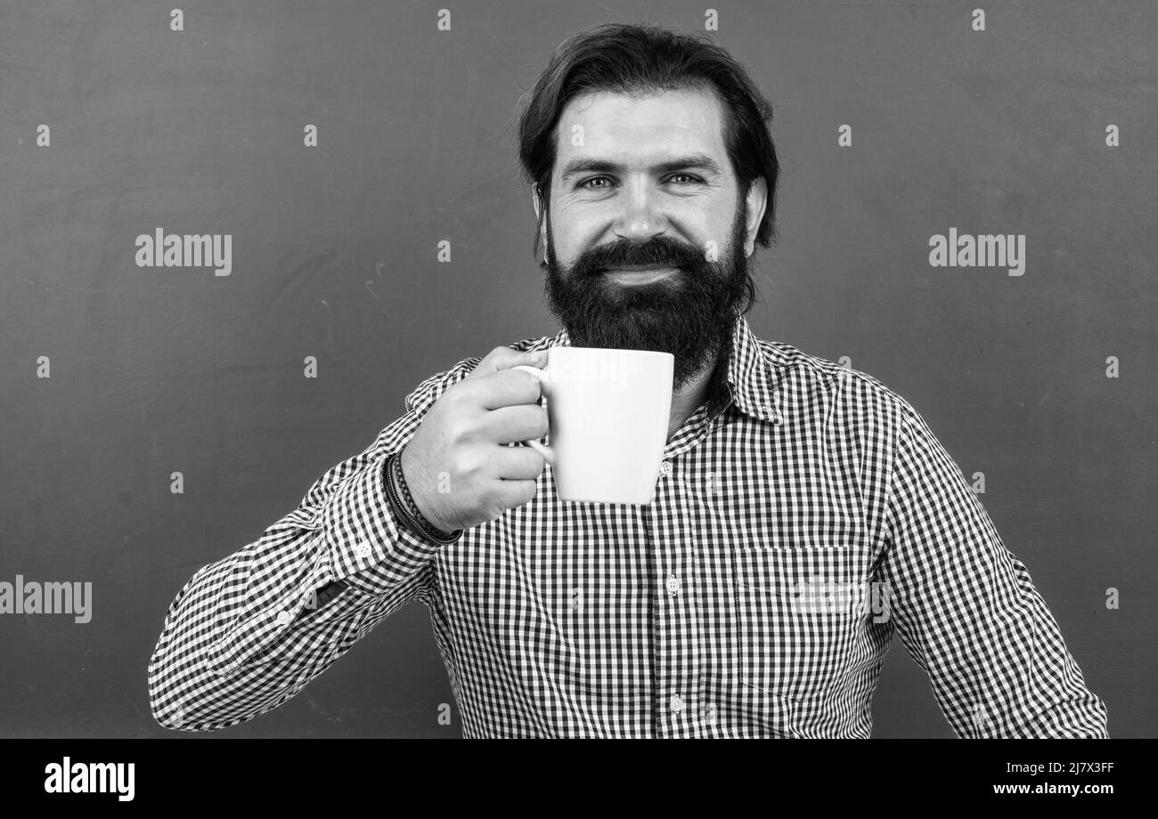 happy man drinking morning coffee from cup on green background, energy ...