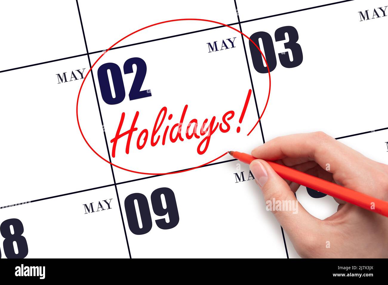2nd day of May. Hand drawing a red circle and writing the text Holidays ...