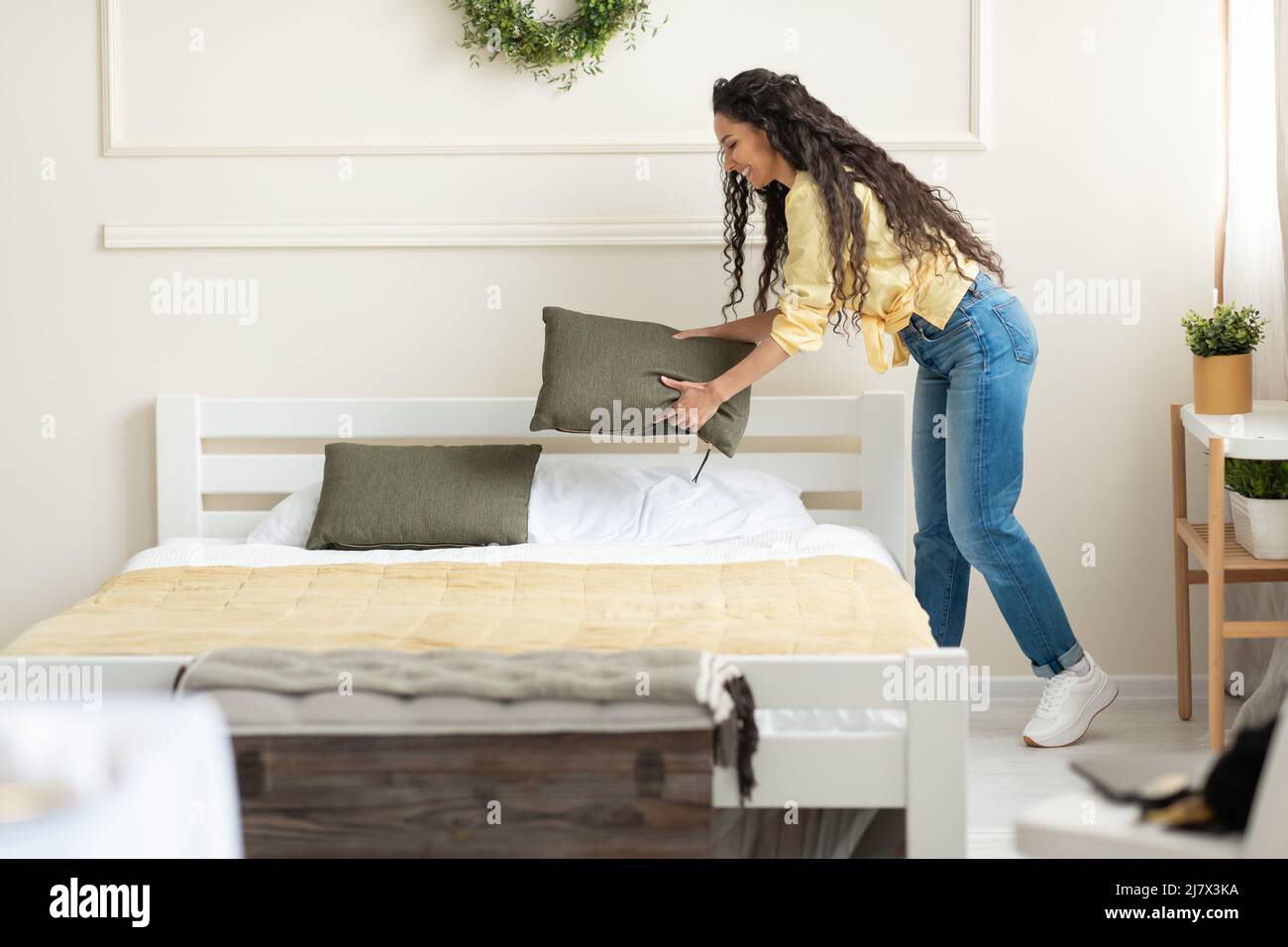 Woman making bed hi-res stock photography and images - Alamy