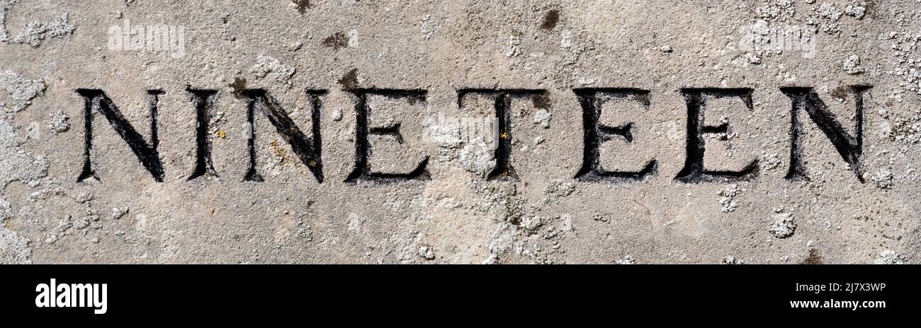 The word NINETEEN on a gravestone Stock Photo - Alamy
