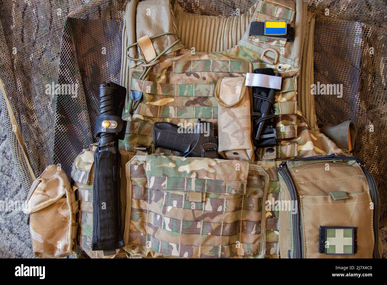 Military reinforced bulletproof vest and pistol, weapon, uniform of a ...