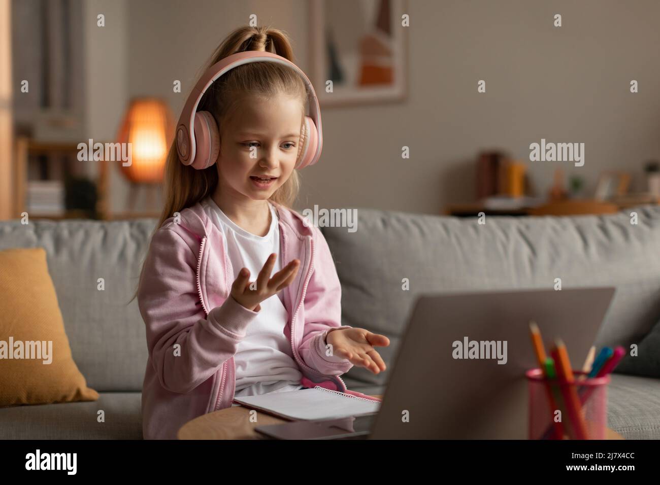 Little Schoolgirl Making Video Call Via Laptop Learning At Home Stock ...