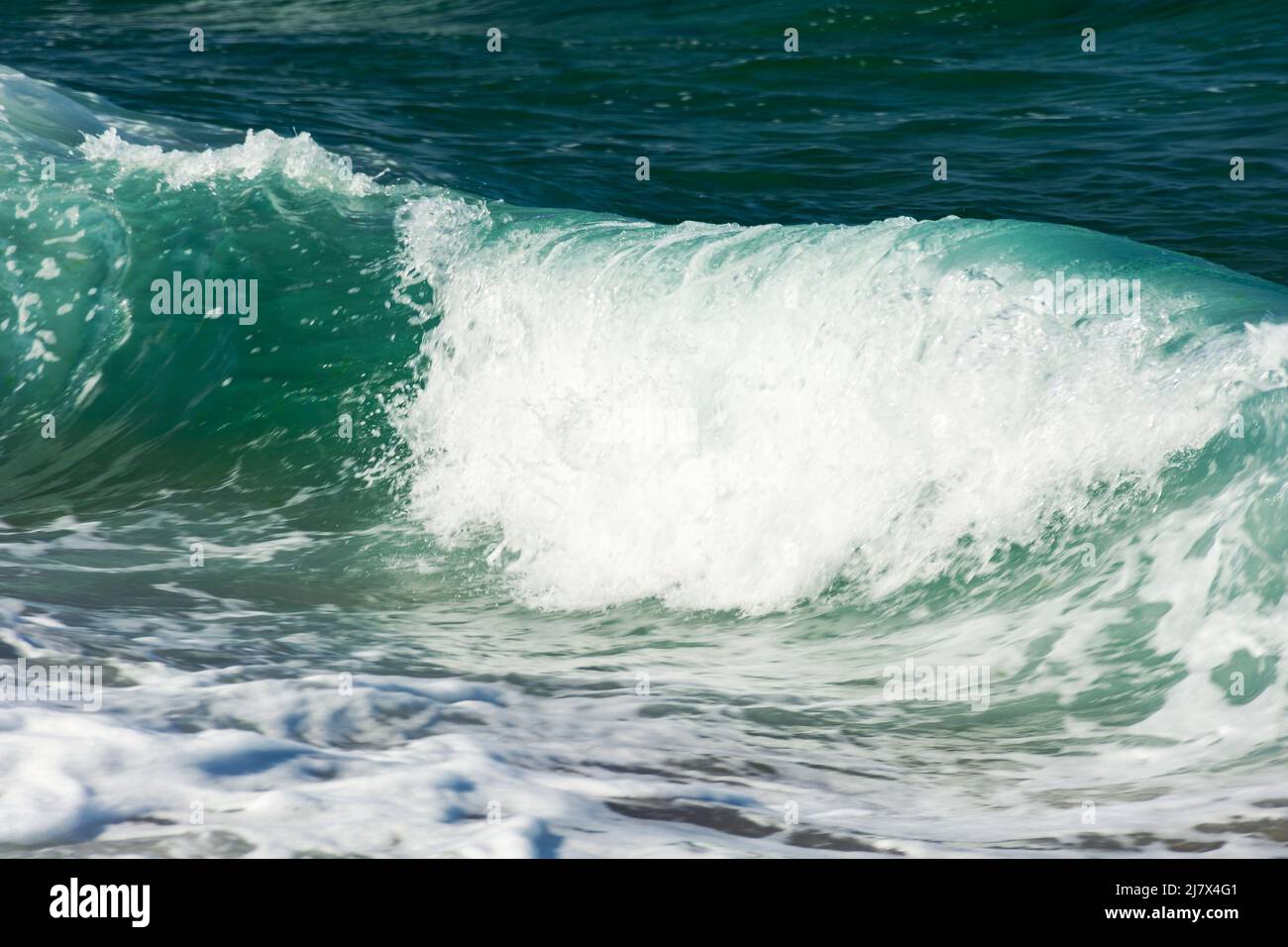 abstract sea background. green wave close up. blurry water in evening ...