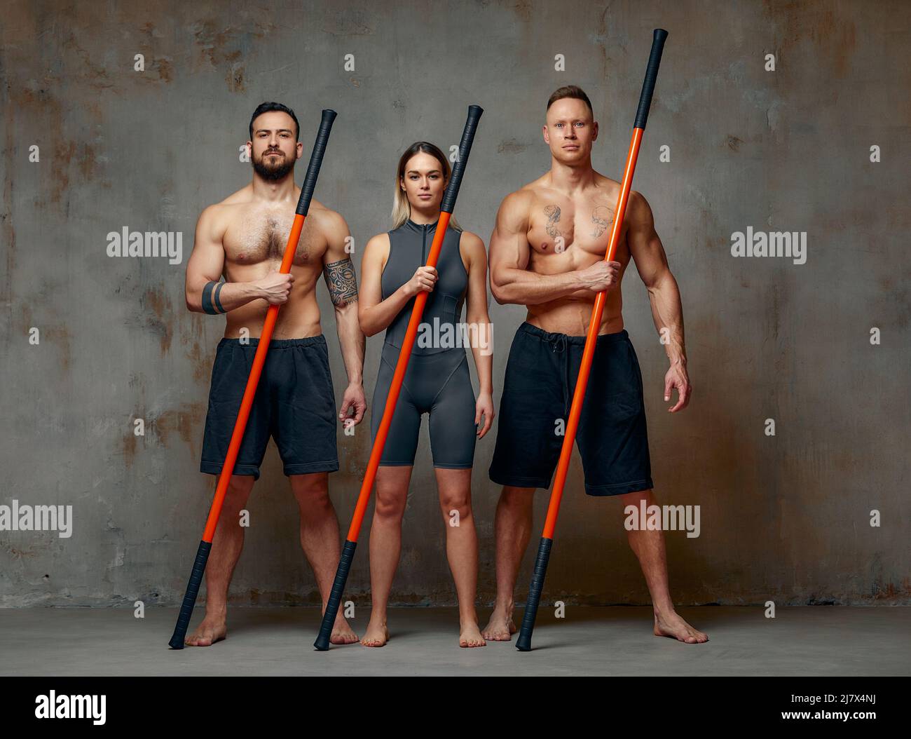 People stand together and practice sticks. Karate masters posing with ...