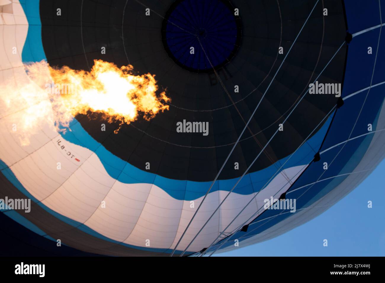 Flame inflating hot air balloon Stock Photo - Alamy