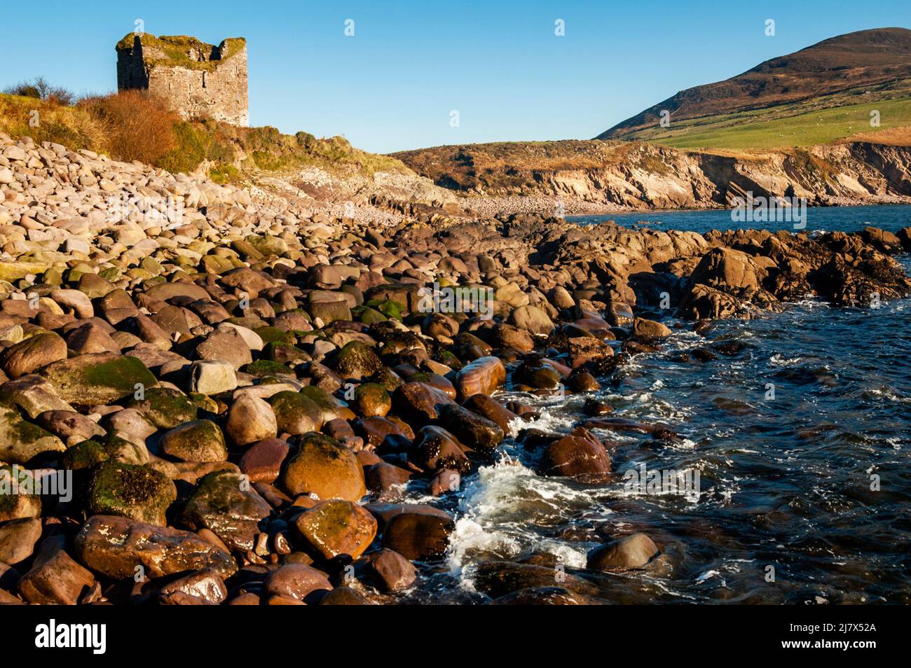 Minard Castle ruin on the Dingle Peninsula scenic drive in southwestern ...