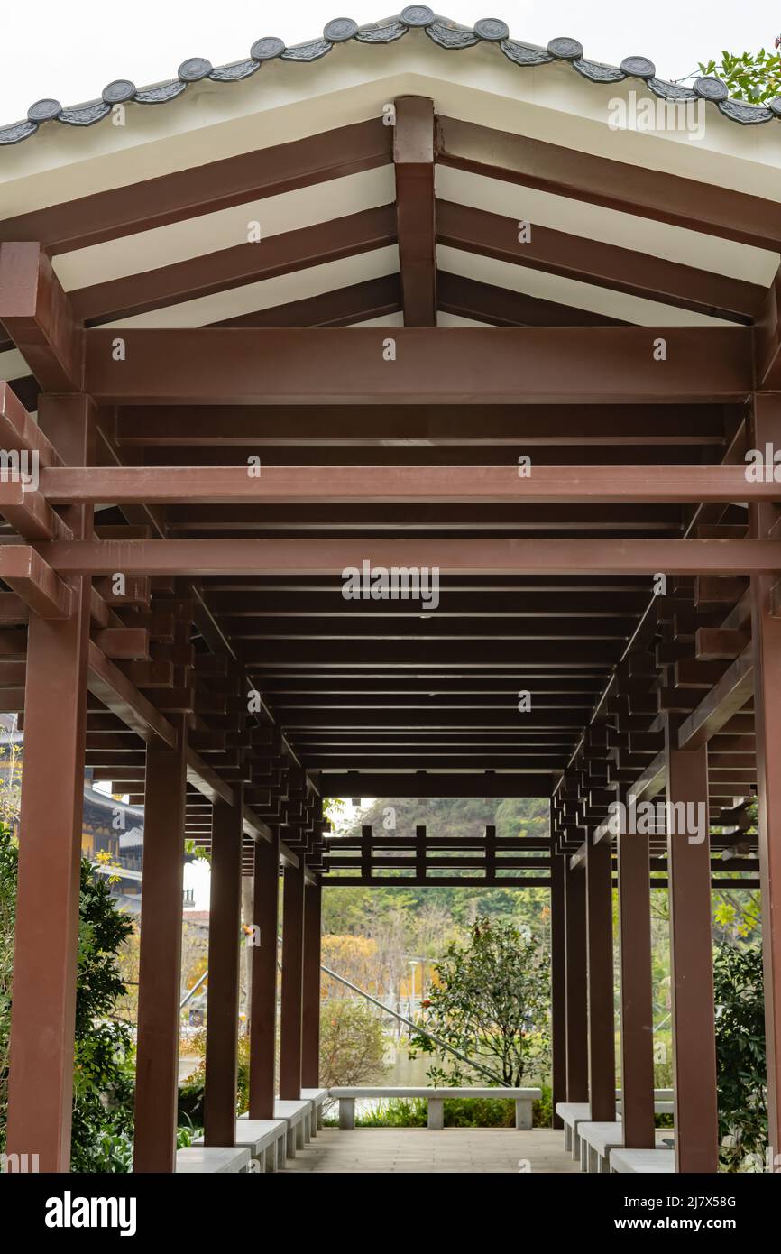 pathway with wooden roofs vertical composition Stock Photo - Alamy