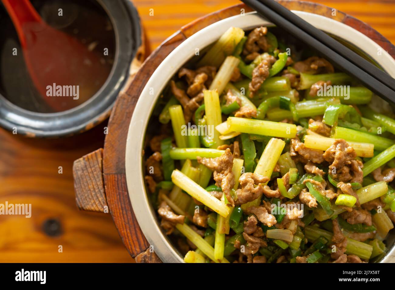 top view fast food of fried pork with celery with bowl of soup ...