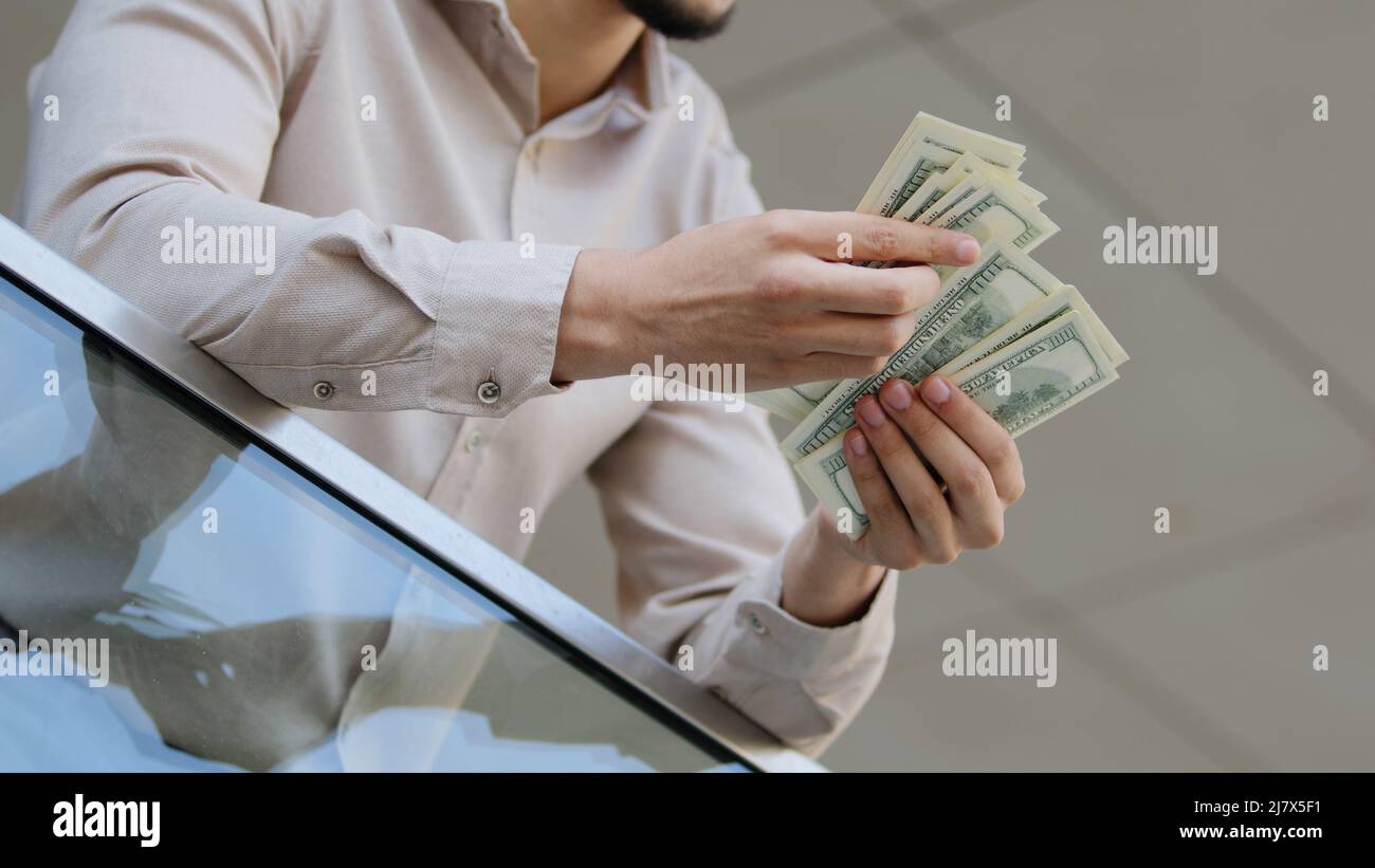 Close Up Of Male Hands Counting Dollar Bills Outdoors Business Man