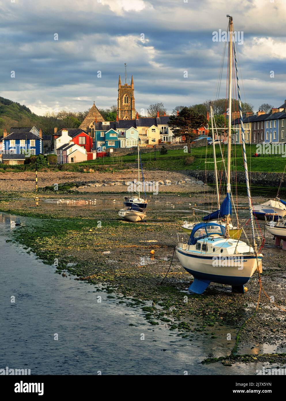 Golden evening sunlight catching Holy Trinity Church and the vibrant ...