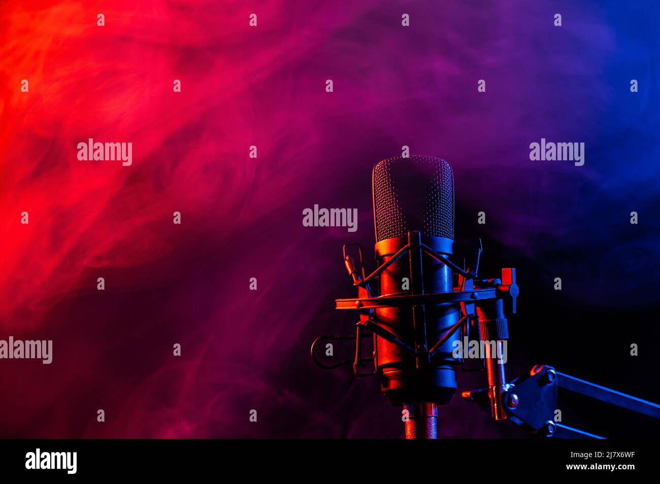 Professional microphone in pink smoke on a black background Stock Photo ...