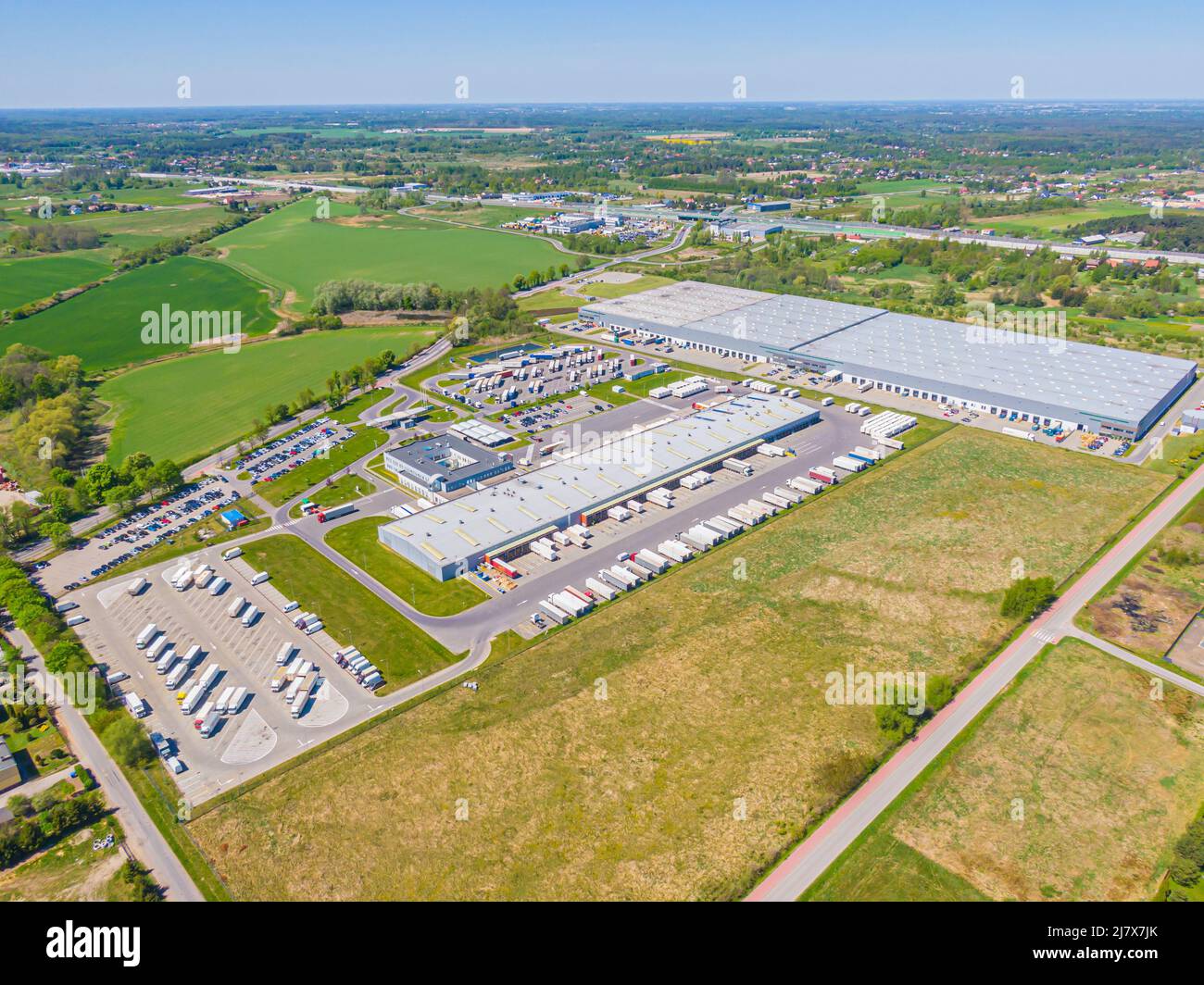 Aerial Shot of Industrial Loading Area where Many Trucks Are Unloading ...