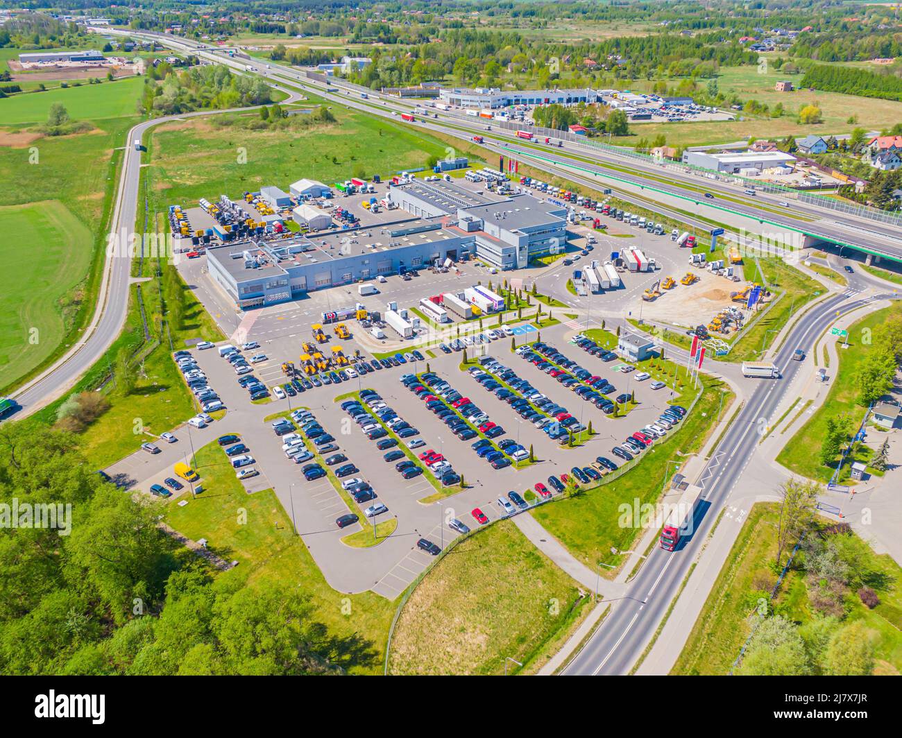 Aerial Shot of Industrial Loading Area where Many Trucks Are Unloading ...