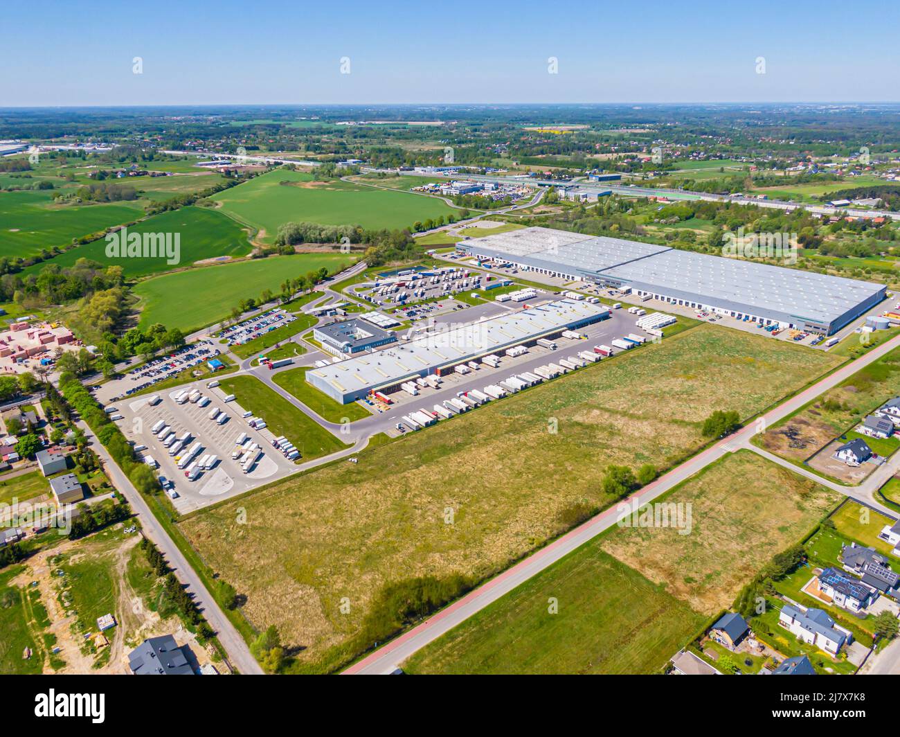 Aerial Shot of Industrial Loading Area where Many Trucks Are Unloading ...