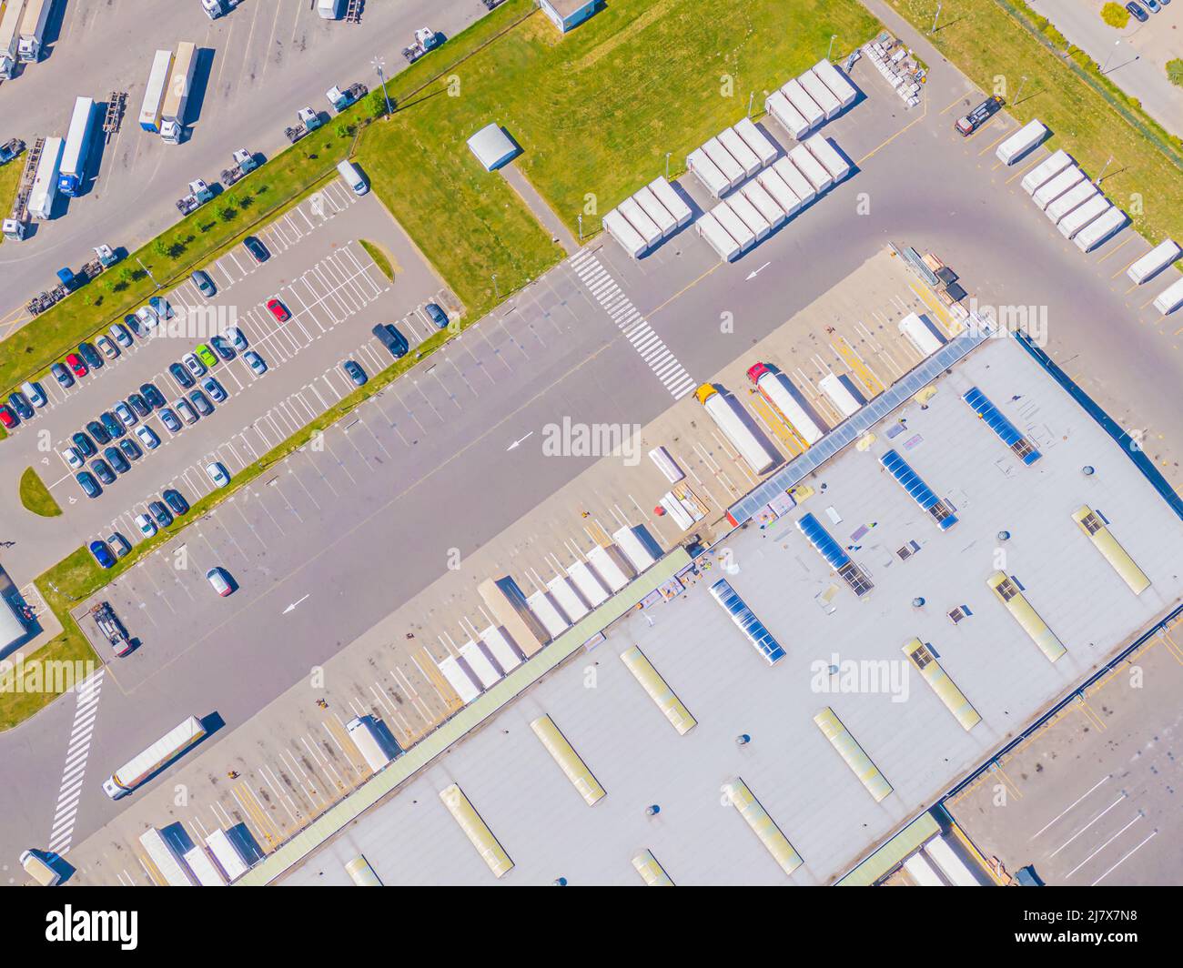 Aerial Shot of Industrial Loading Area where Many Trucks Are Unloading ...