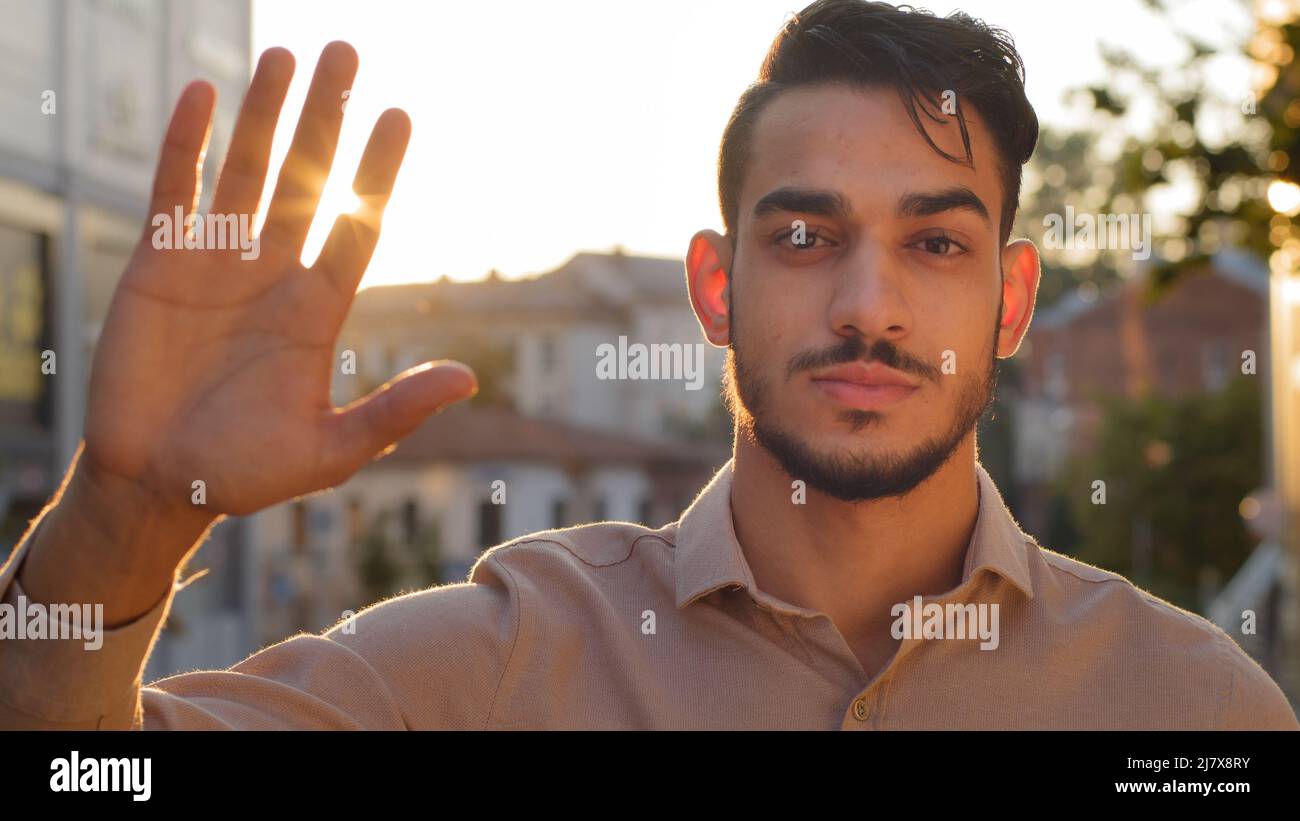 Male portrait outdoors in city young adult serious attractive bearded ...