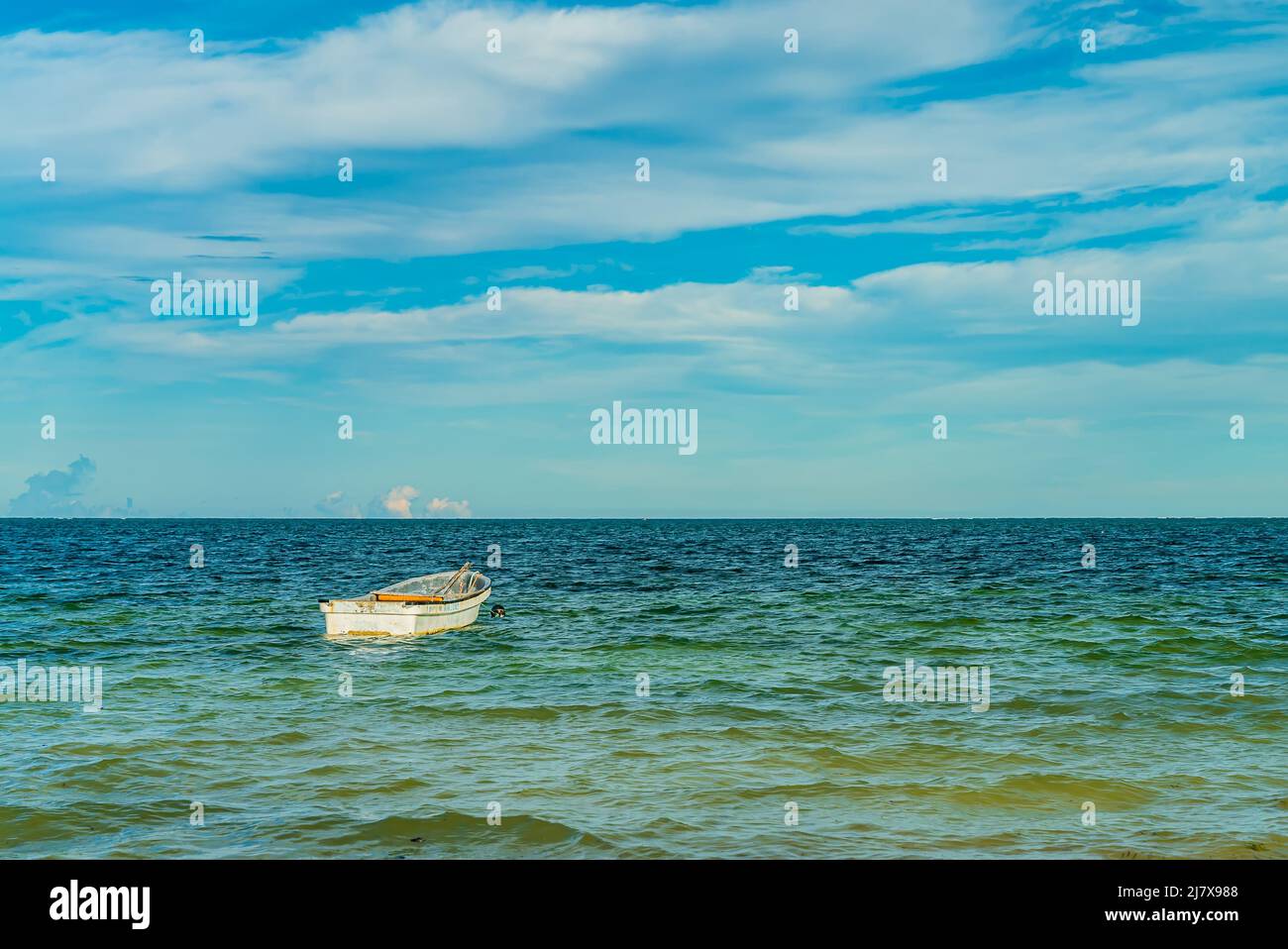 One fishing boat in water of Indian ocean. Zanzibar, Tanzania Stock ...