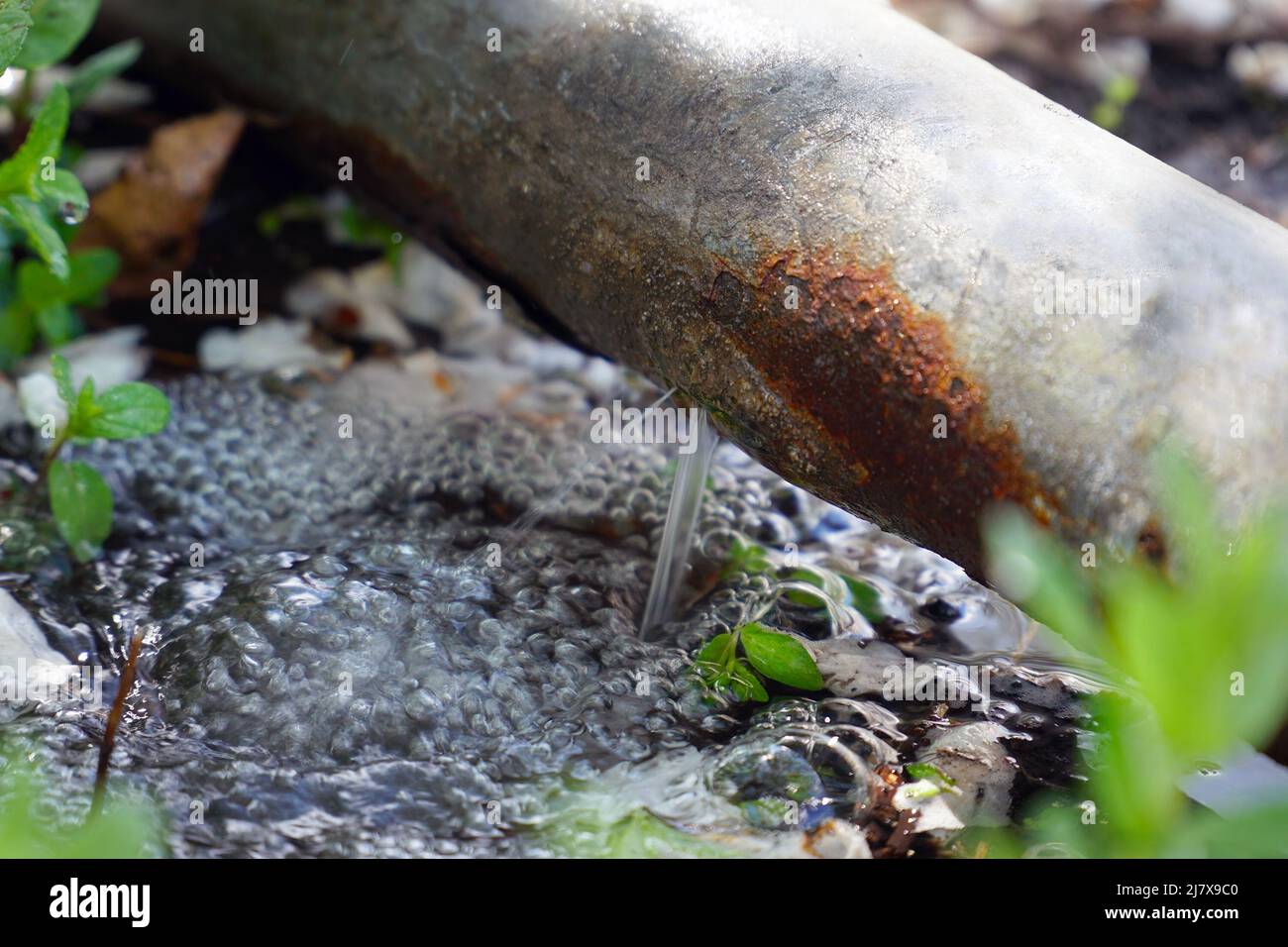 Water leak or breakthrough rusty pipe Stock Photo - Alamy