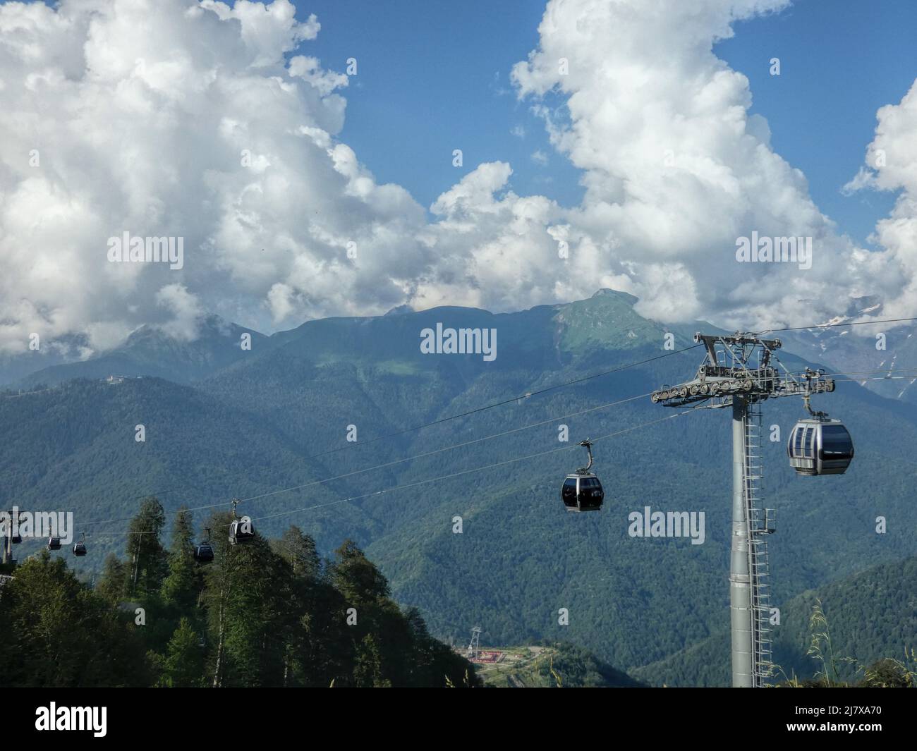 Cable way in mountains. Sunny summer day Stock Photo - Alamy