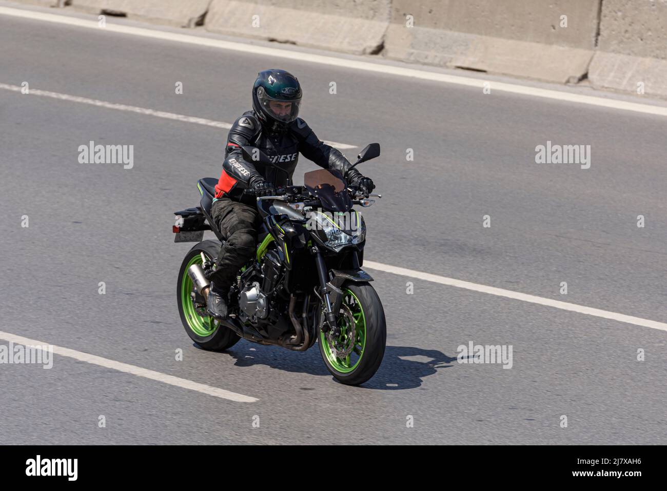 ISTANBUL, TURKEY - MAY 1, 2022: Man from city riding motorcycle on the ...
