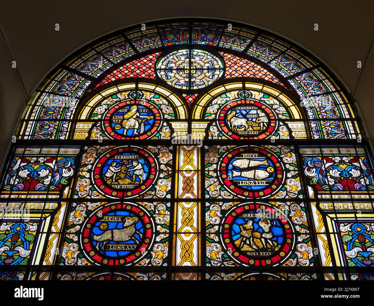 A Stained glass window depicting the star signs at Penrhyn Castle ...