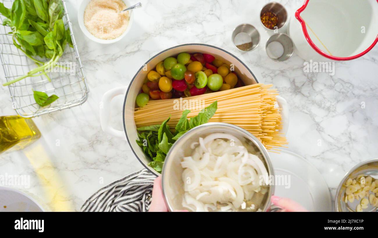 Flat lay. Step by step. Cooking on pot pasta recipe in an enameled cast ...