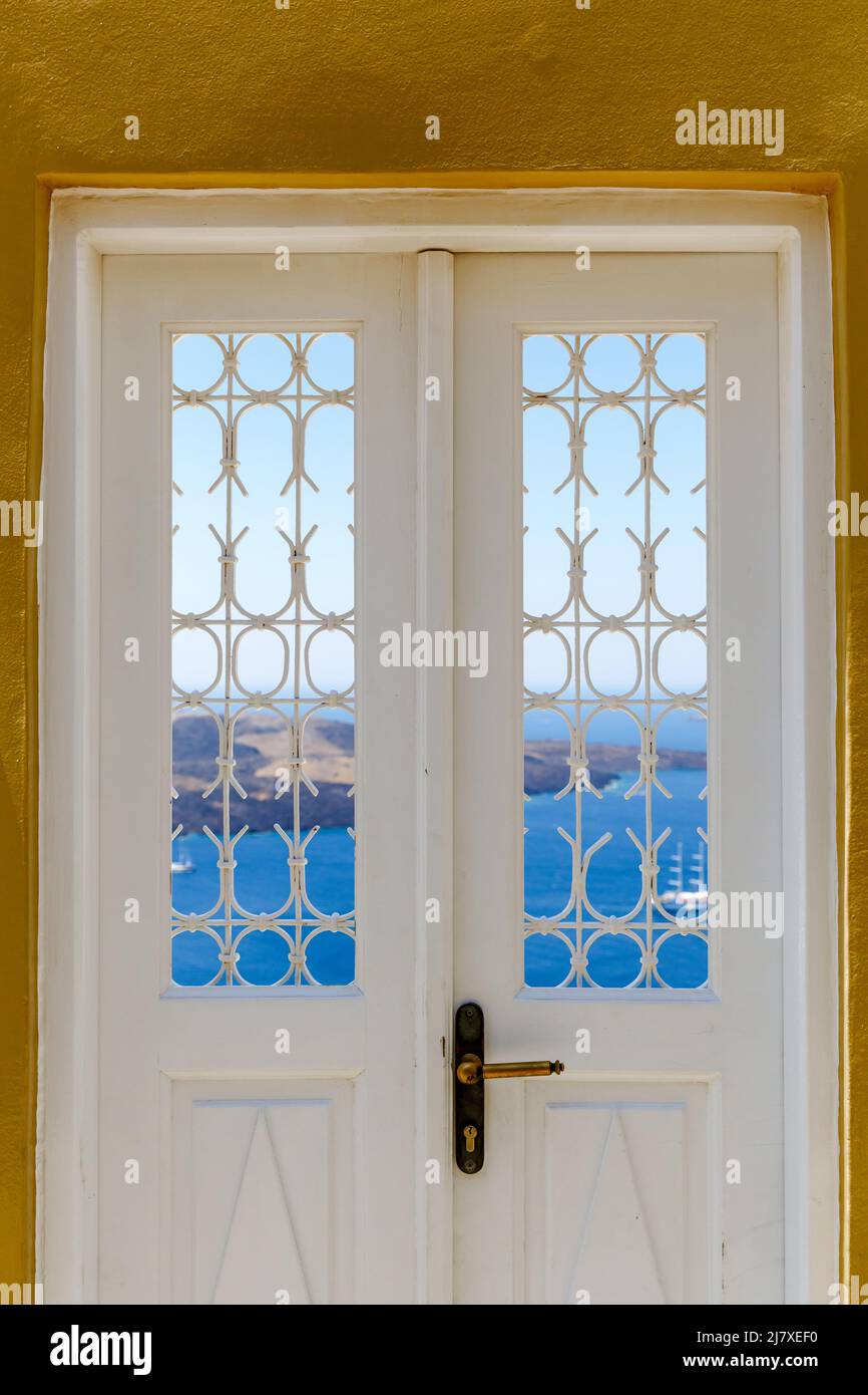 White door in front of the blue sea Stock Photo - Alamy